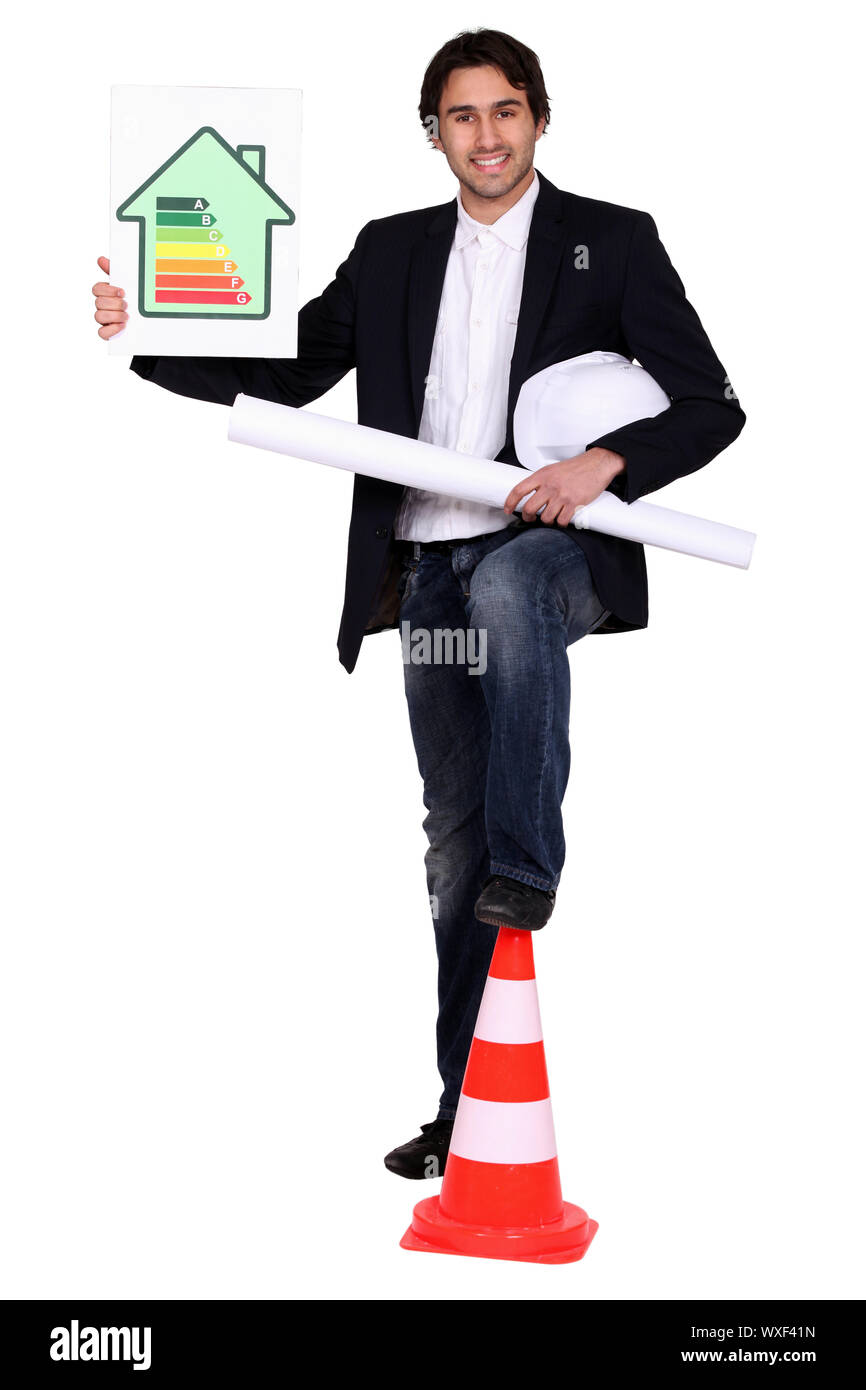 young architect posing with leg on construction cone Stock Photo - Alamy