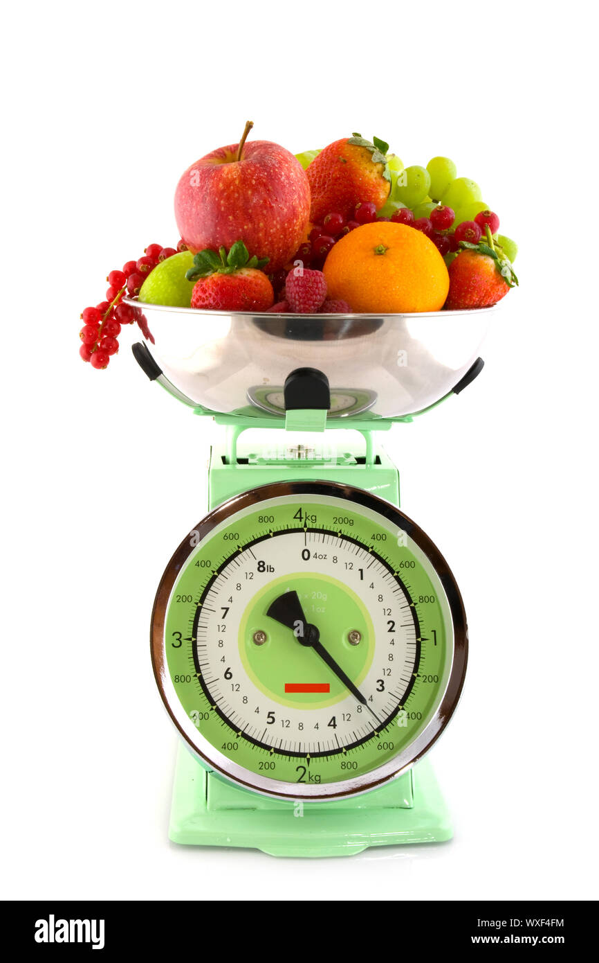 Kitchen scale with a diversity fruit for diet Stock Photo - Alamy