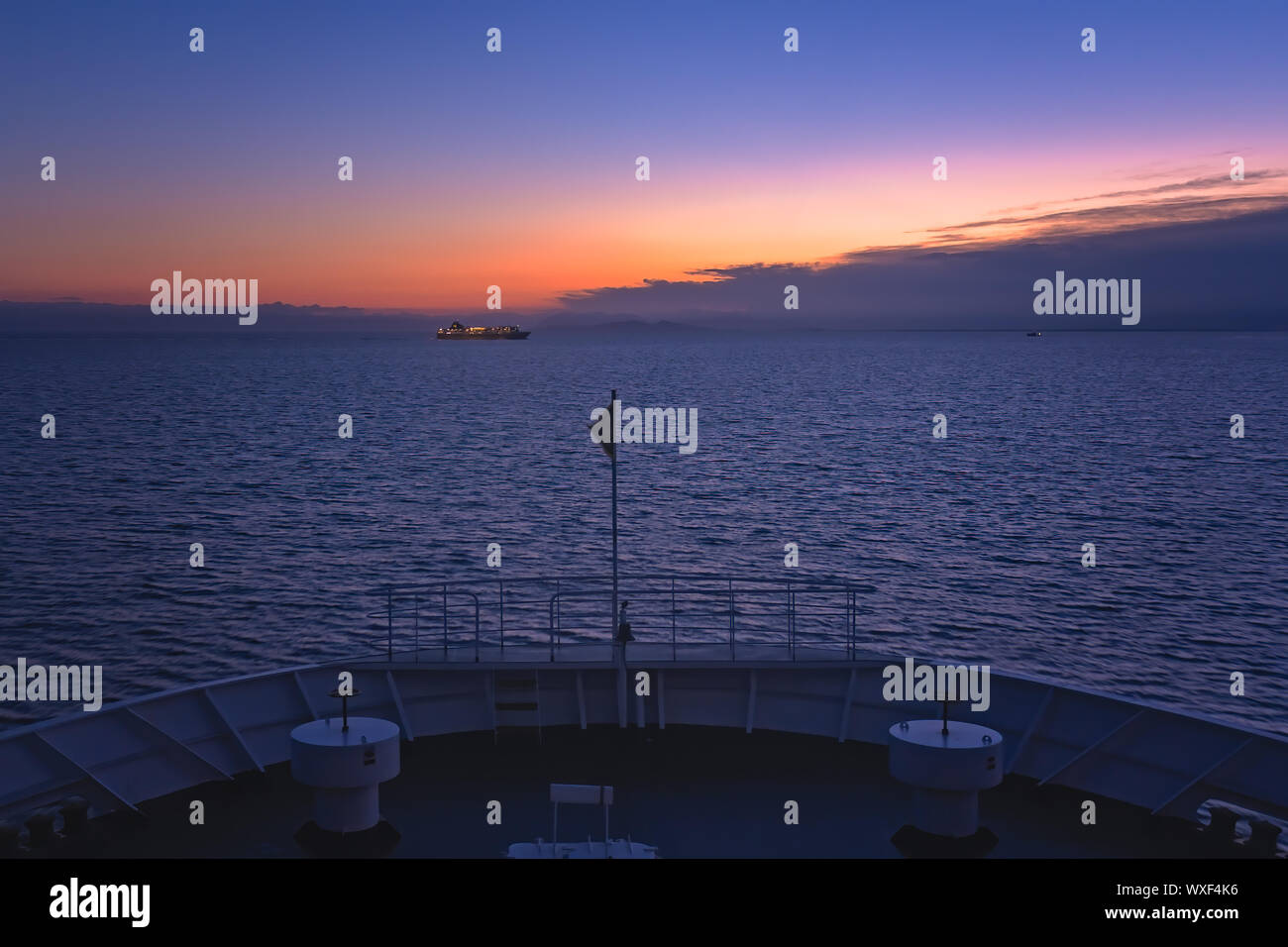 Front of a large passenger ferry sailing at dawn Stock Photo - Alamy