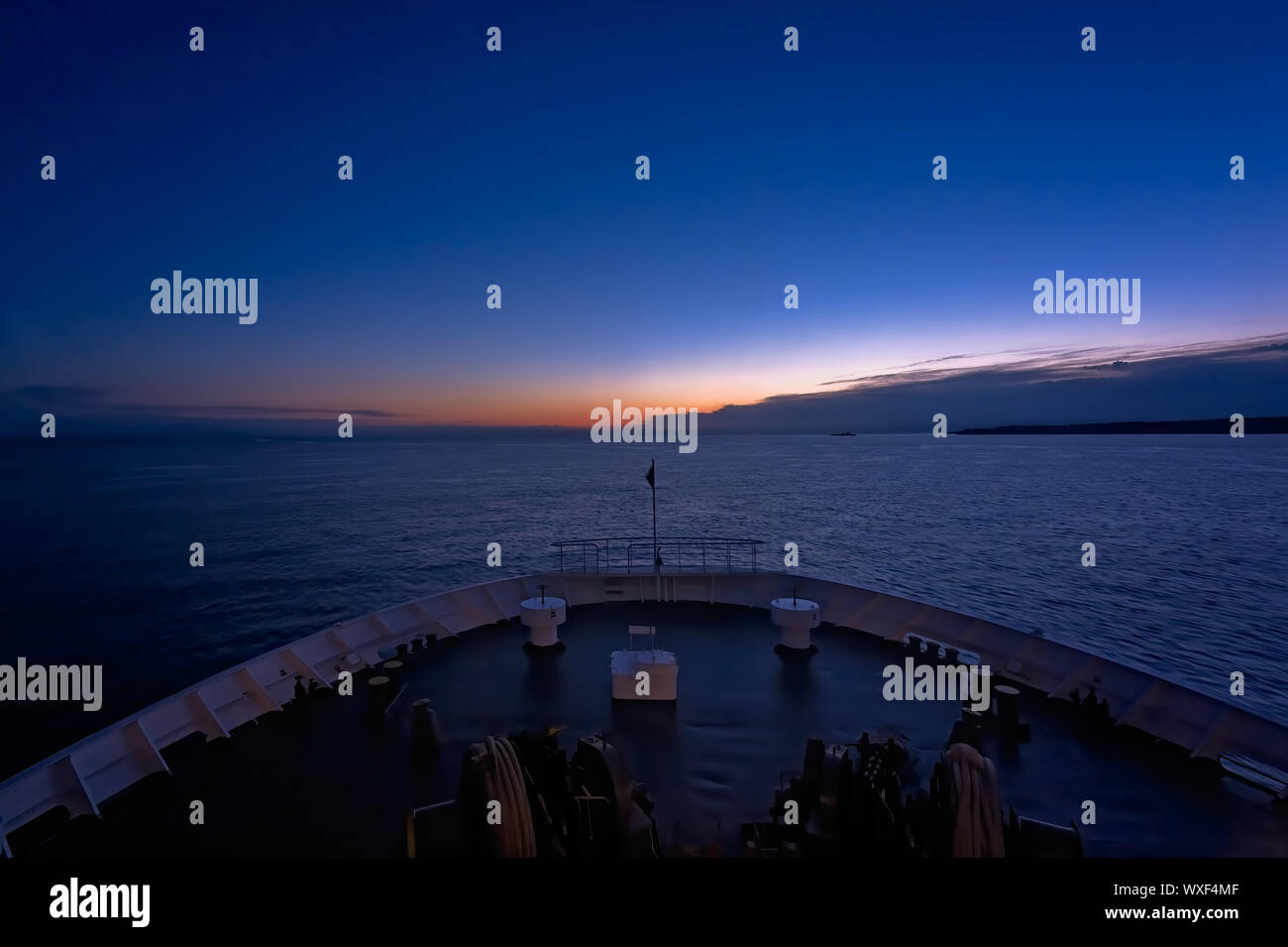 Front of a large passenger ferry sailing at dawn Stock Photo - Alamy