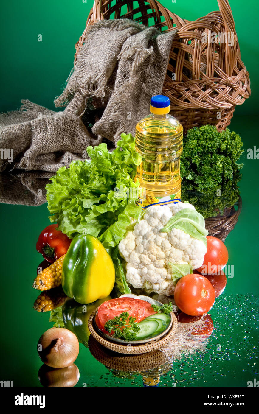 Oil, Basket And Vegetables Stock Photo - Alamy