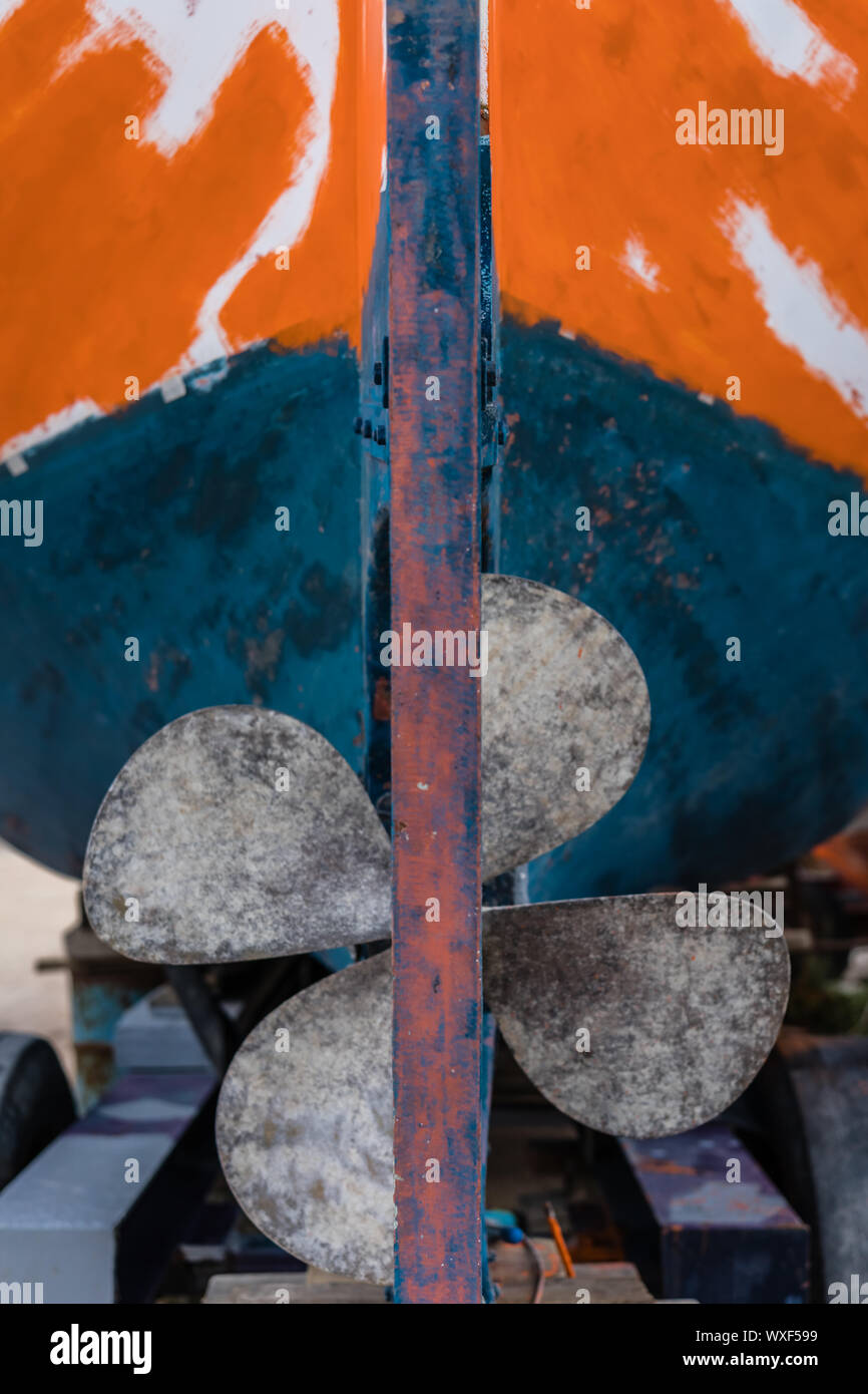 Four blades fisherman boat propeller Stock Photo - Alamy