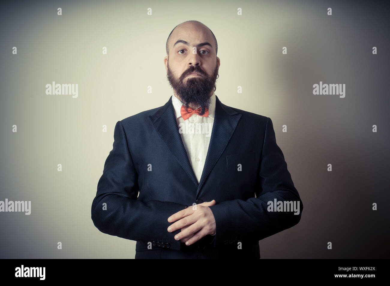 funny elegant bearded man on vignetting background Stock Photo - Alamy