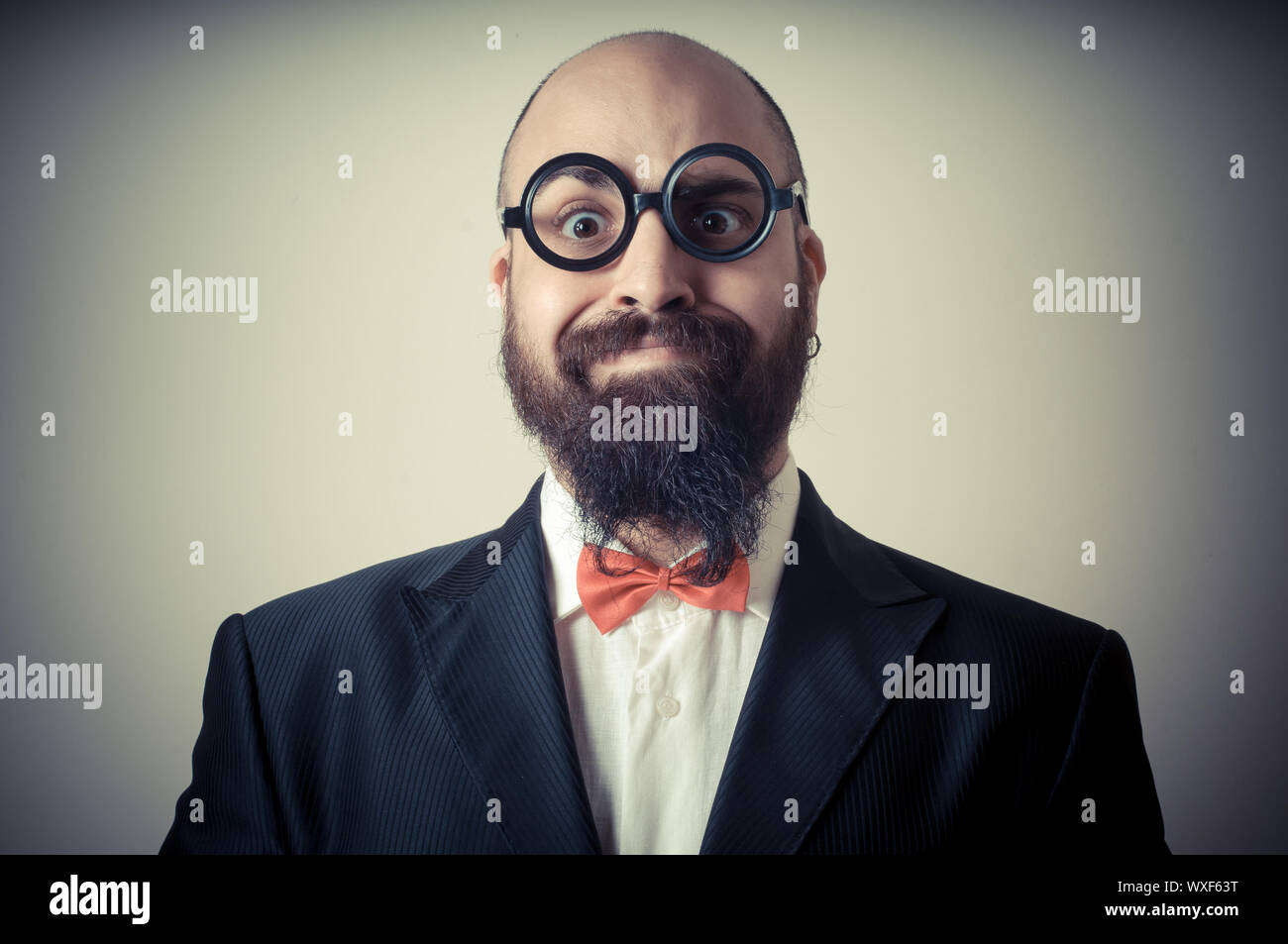 funny elegant bearded man on vignetting background Stock Photo - Alamy