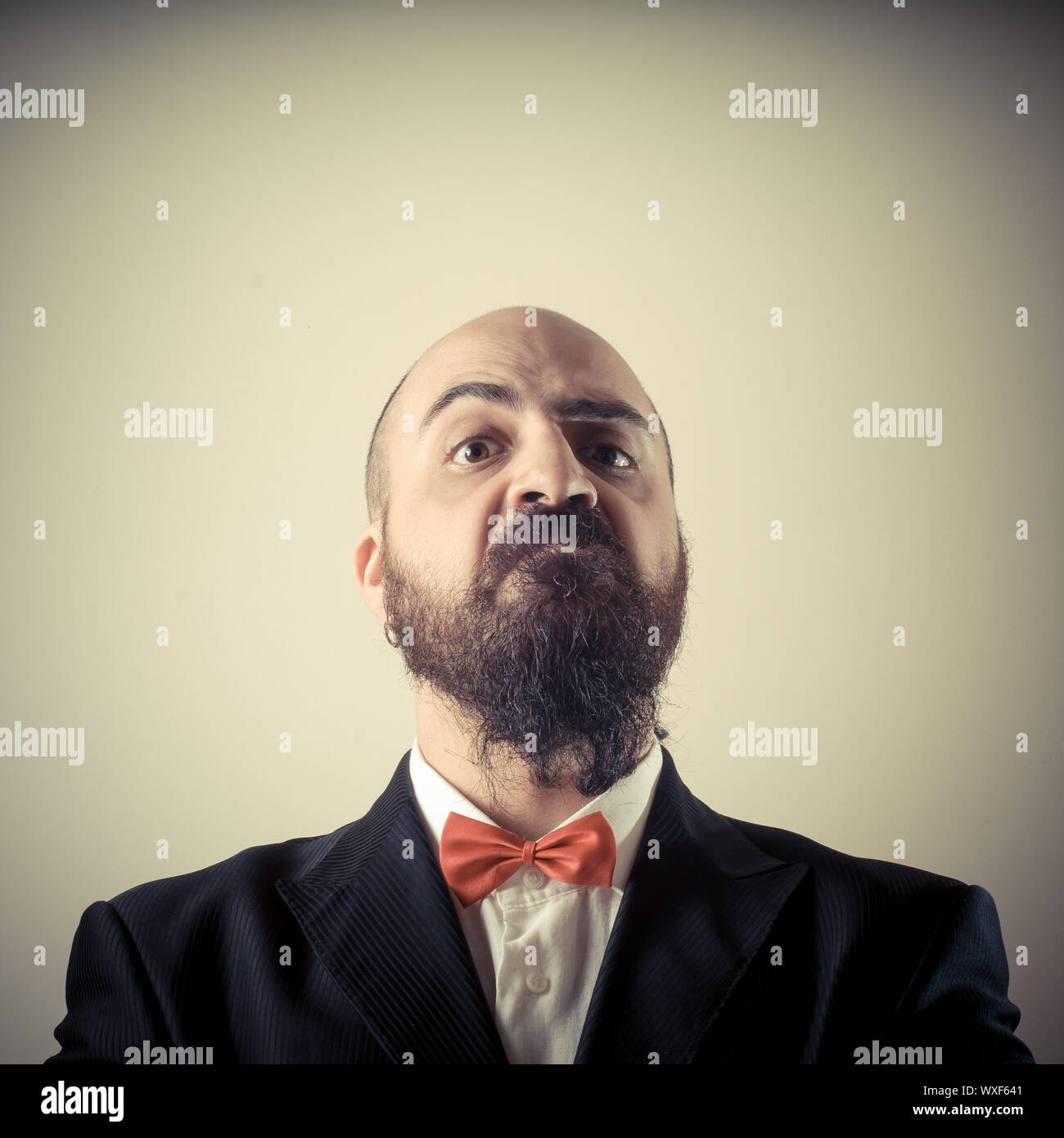 funny elegant bearded man on vignetting background Stock Photo - Alamy