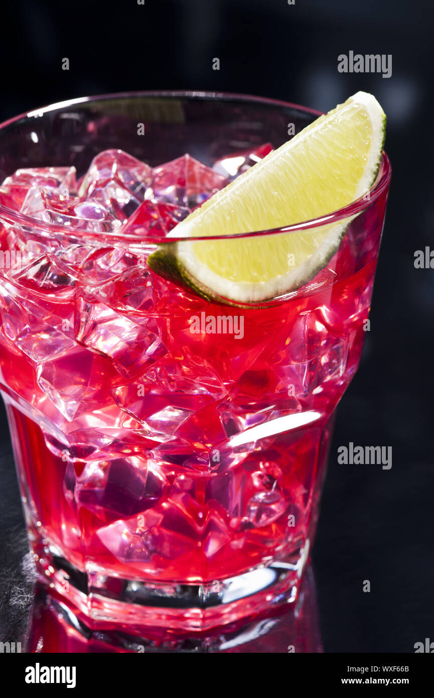 Red Campari Cocktail in short glass with lemon decoration Stock Photo ...