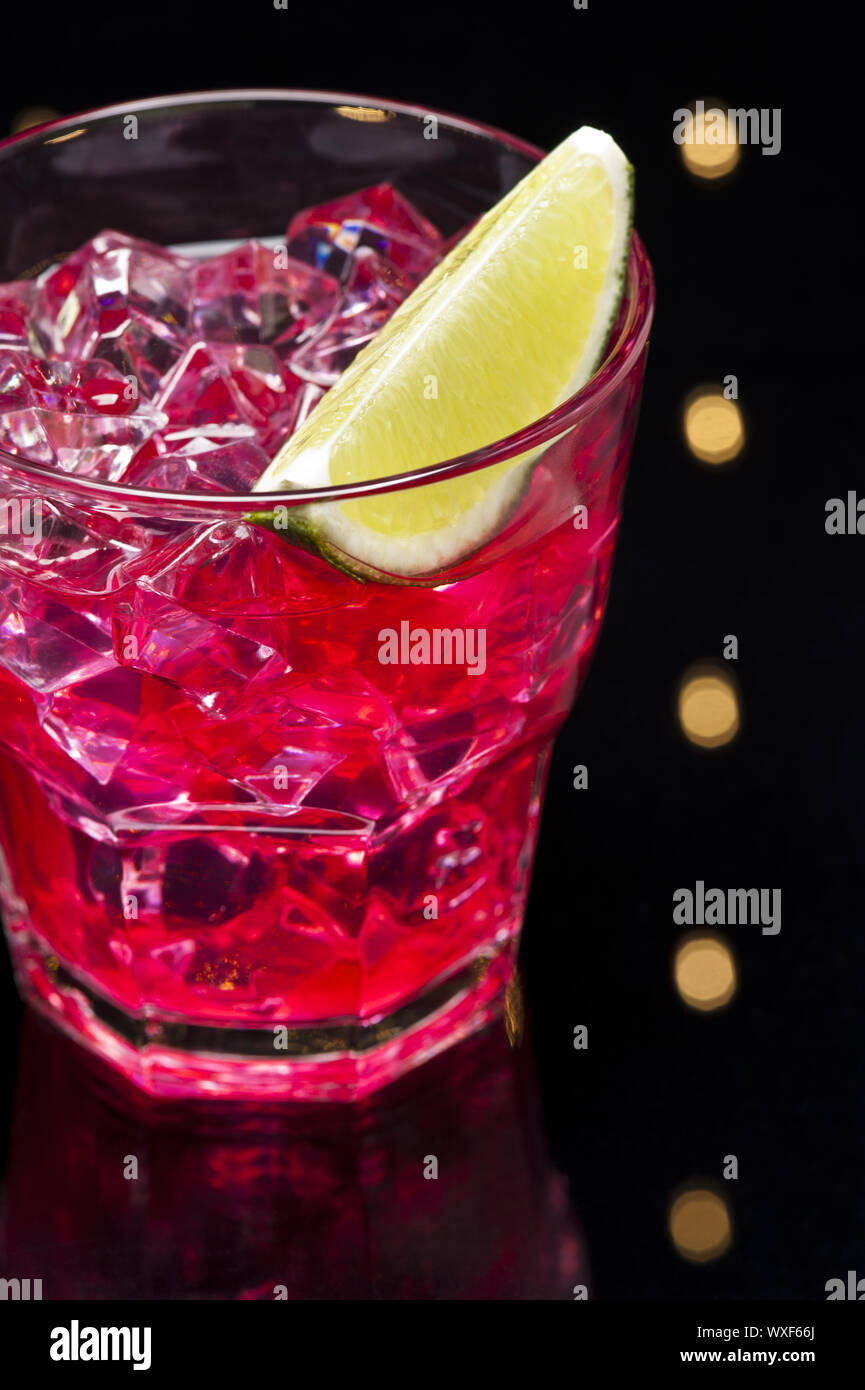 Red Campari Cocktail in short glass with lemon decoration Stock Photo ...