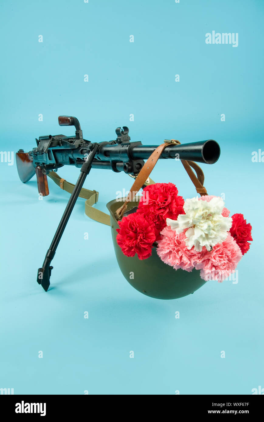 Machine Gun And Flowers Stock Photo - Alamy