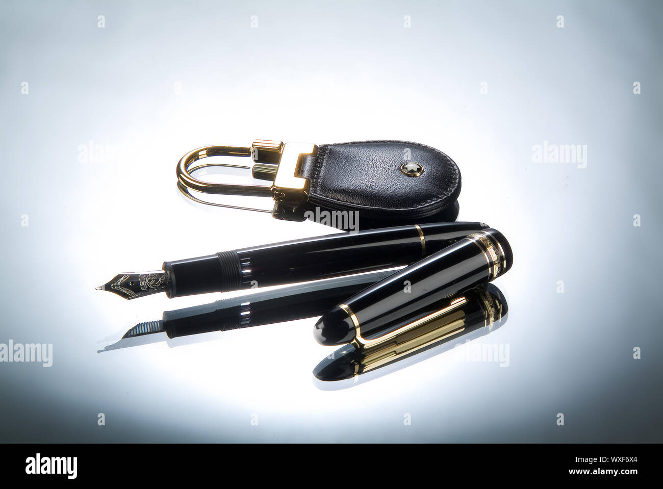 Keychain And Pen On A Glass Stock Photo - Alamy