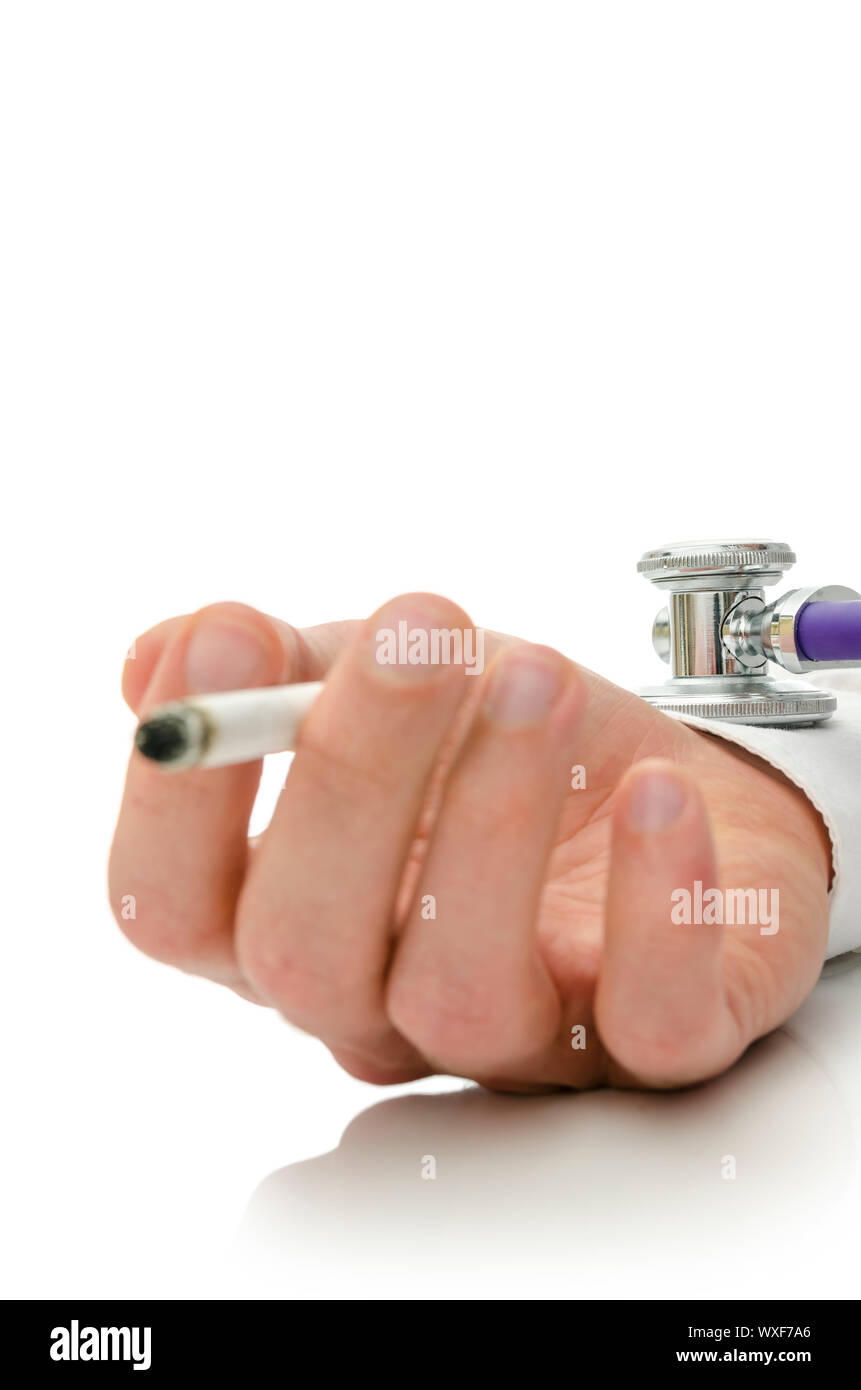 Stethoscope on smoker hand holding a cigarette. Concept of health ...