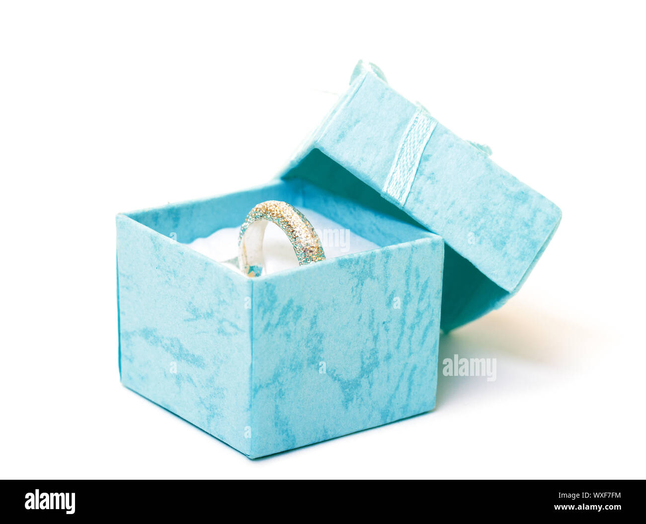 Cyan gift boxes with ring closeup on white background Stock Photo - Alamy