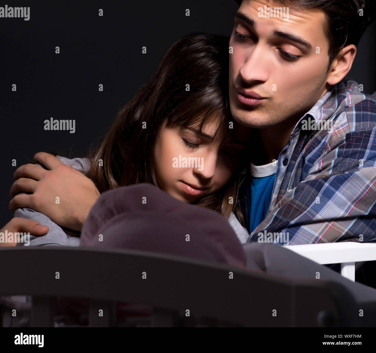 Young parents sleepless with newborn baby at night Stock Photo - Alamy