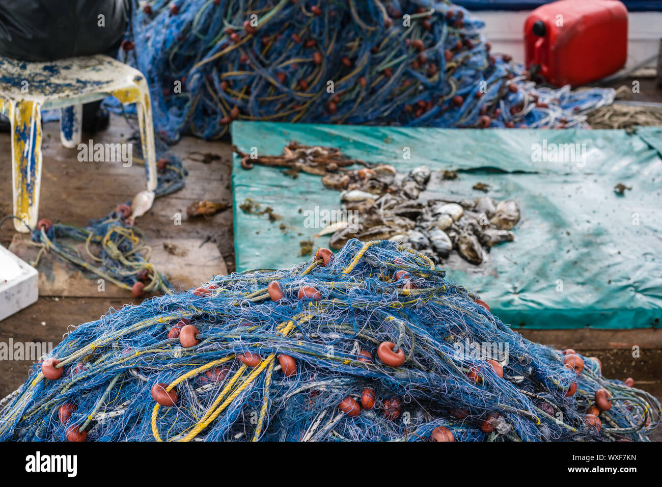 Pile of blue fishing nets Stock Photo - Alamy