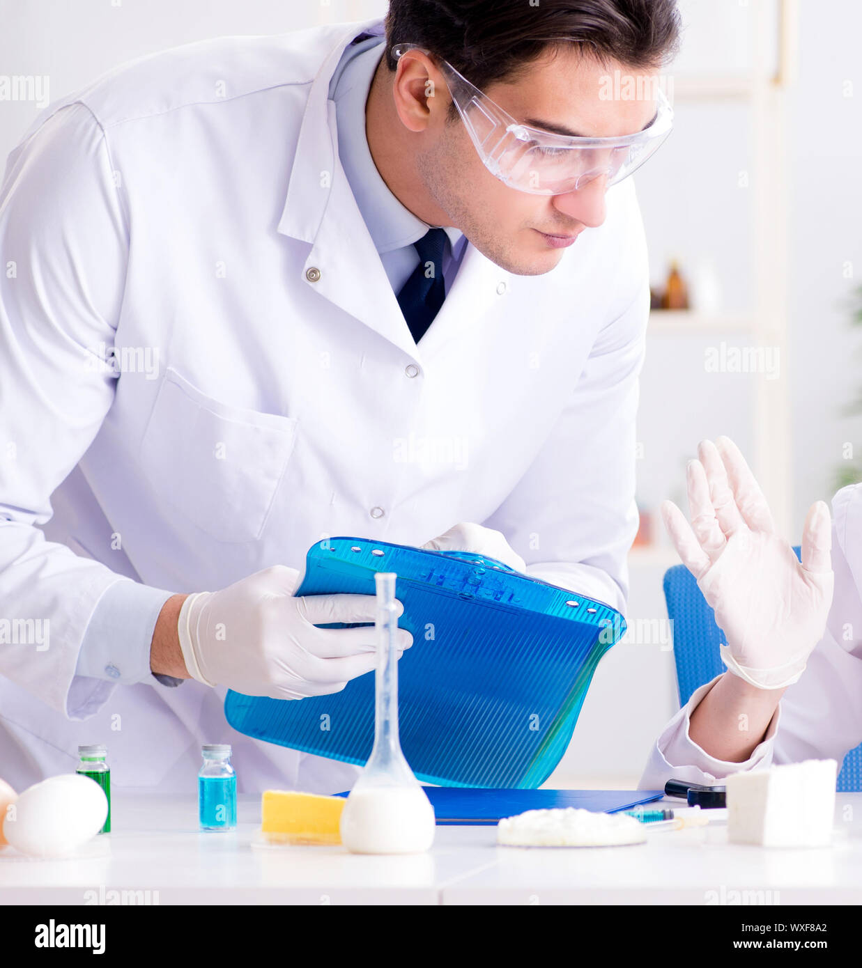 Two lab doctor testing food products Stock Photo - Alamy
