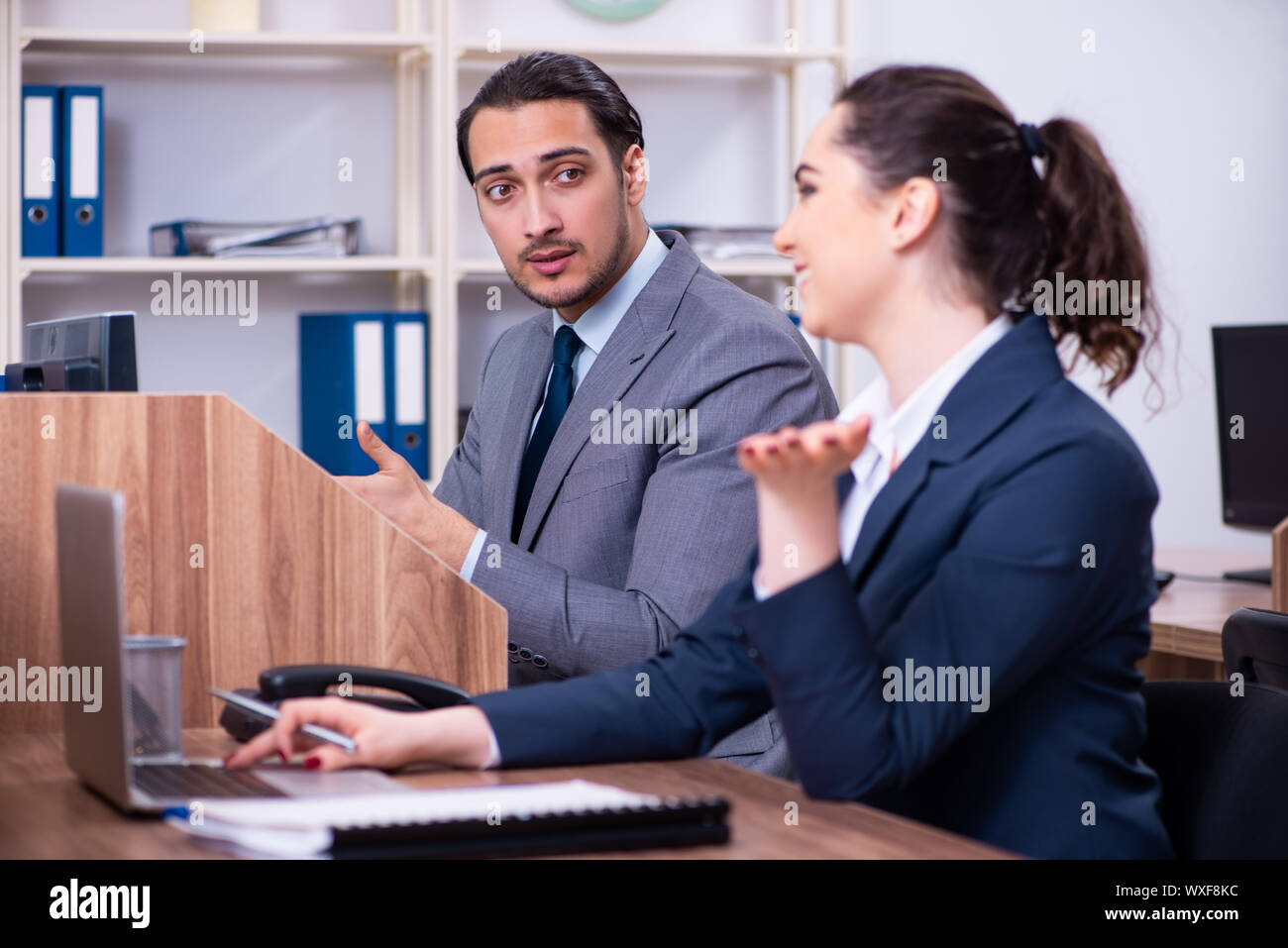 Two employees working in the office Stock Photo - Alamy