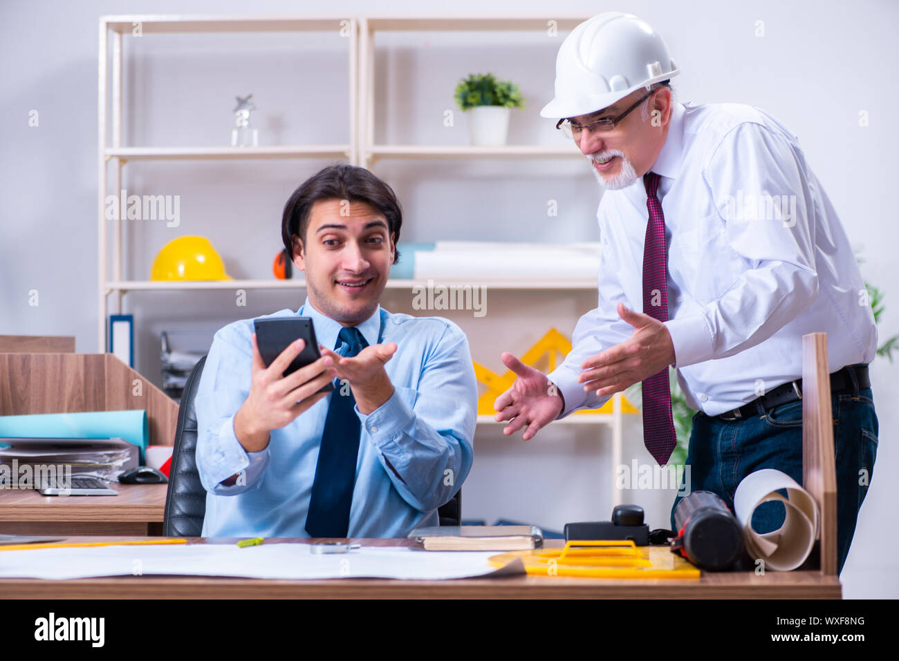 Two architects working on the project Stock Photo - Alamy
