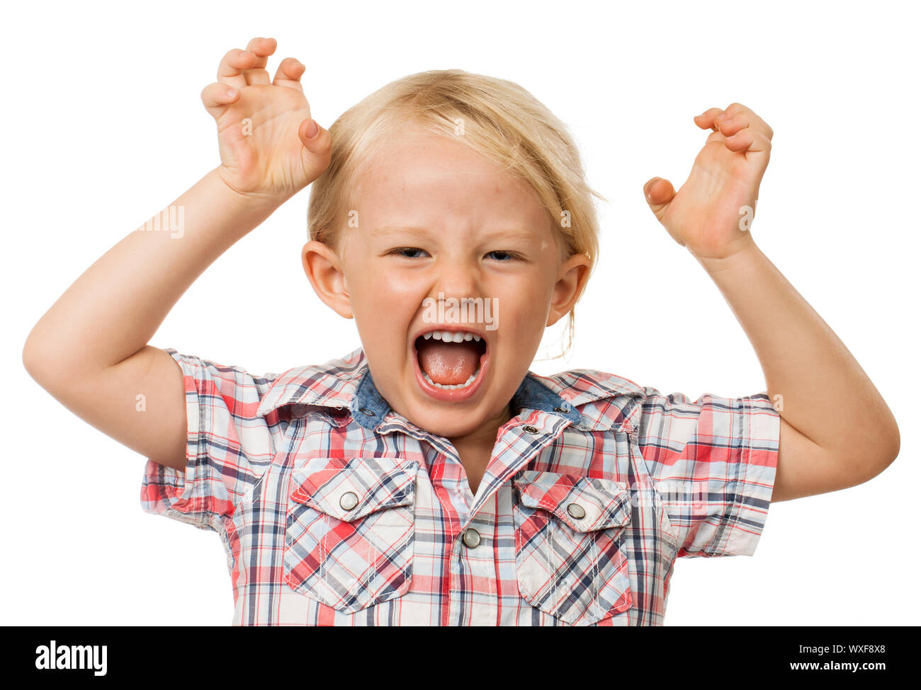 A angry hyperactive young boy screaming. Isolated on white Stock Photo ...