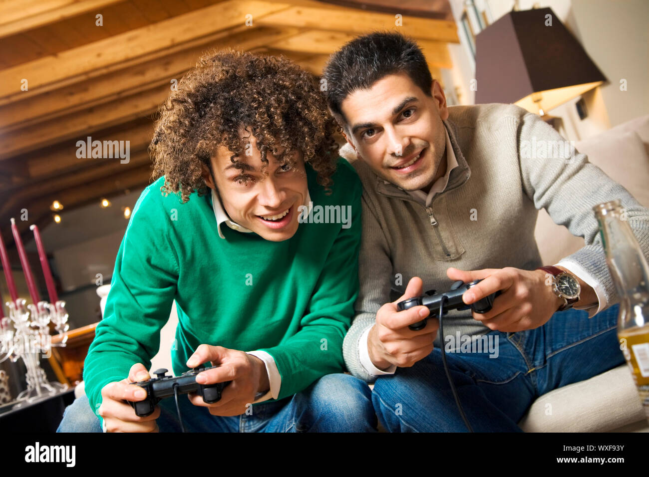 men having fun with a new videogame Stock Photo - Alamy