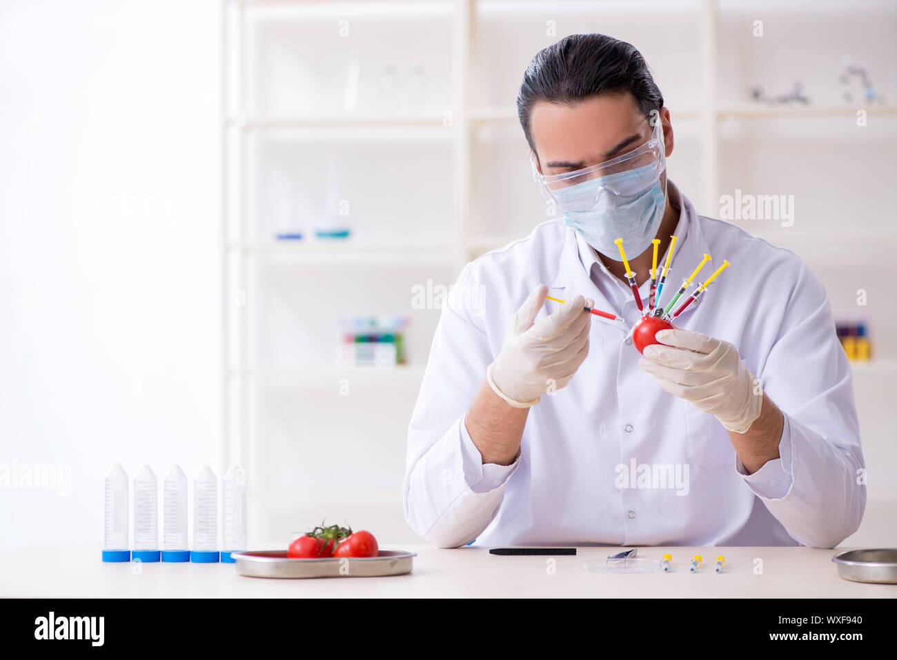 Male nutrition expert testing food products in lab Stock Photo - Alamy