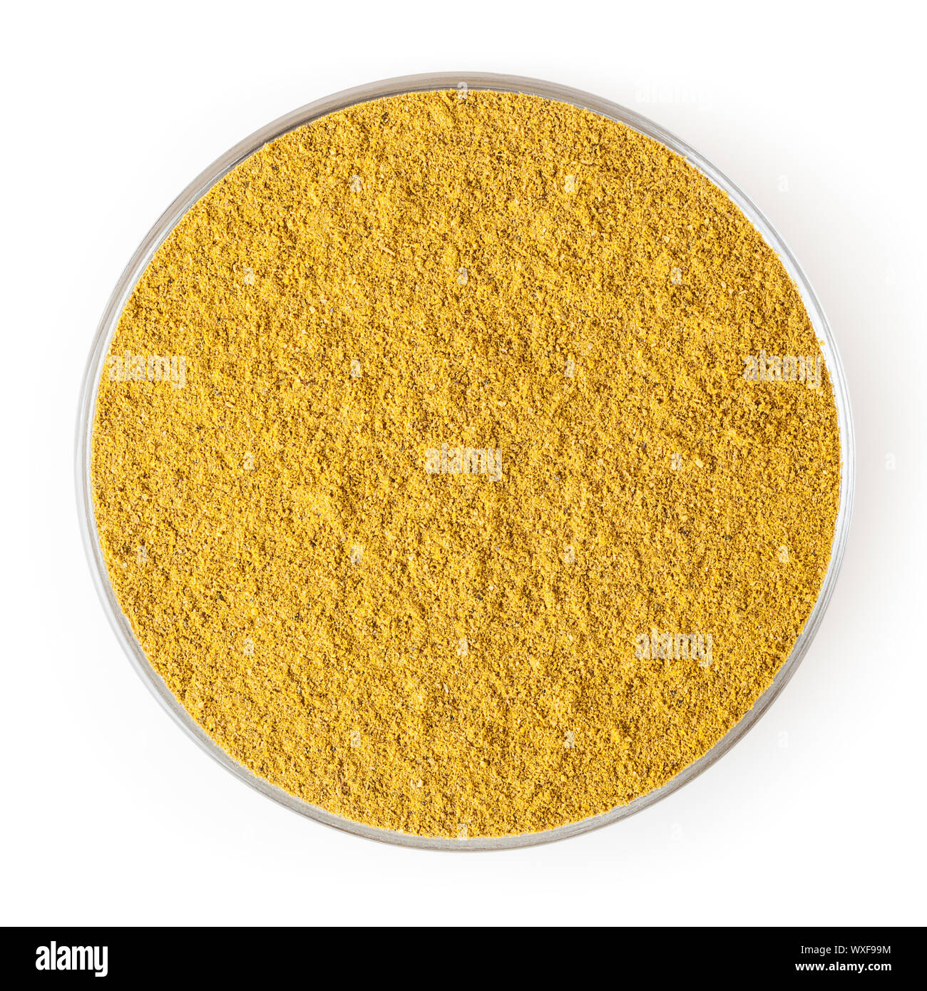 Curry powder in glass bowl isolated on white background with clipping ...
