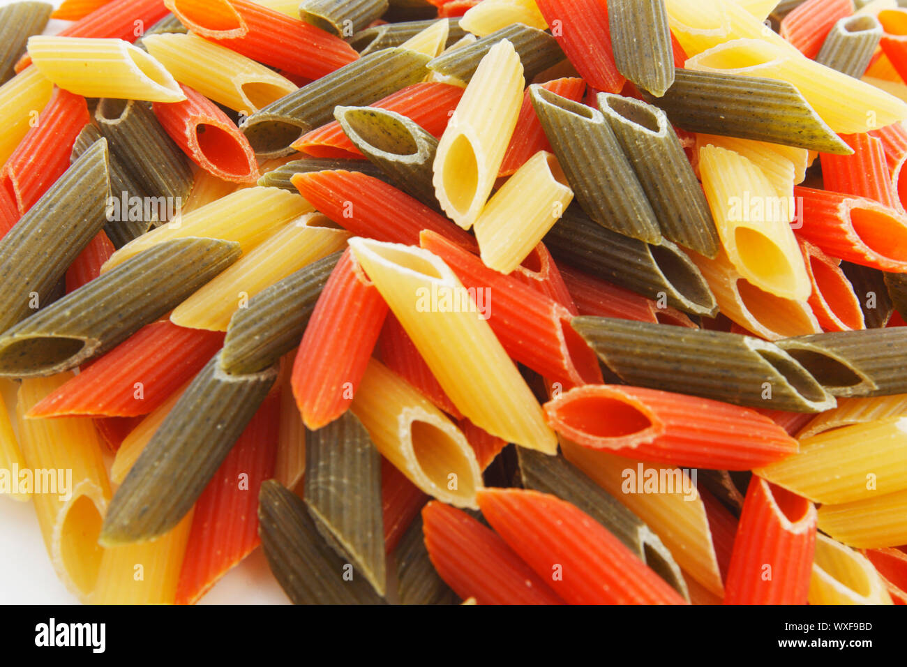 Colored dry italian pasta background Stock Photo - Alamy
