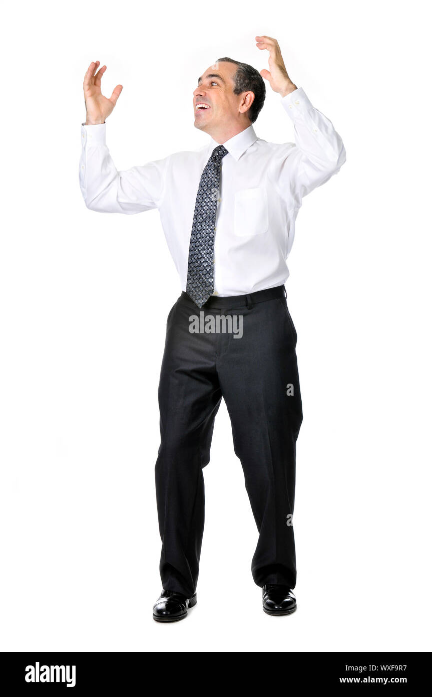 Happy celebrating business man in suit isolated on white background ...