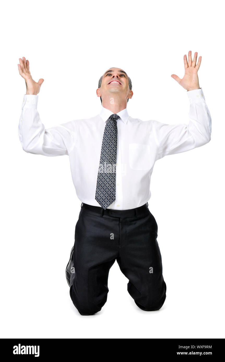 Happy celebrating business man in suit isolated on white background ...