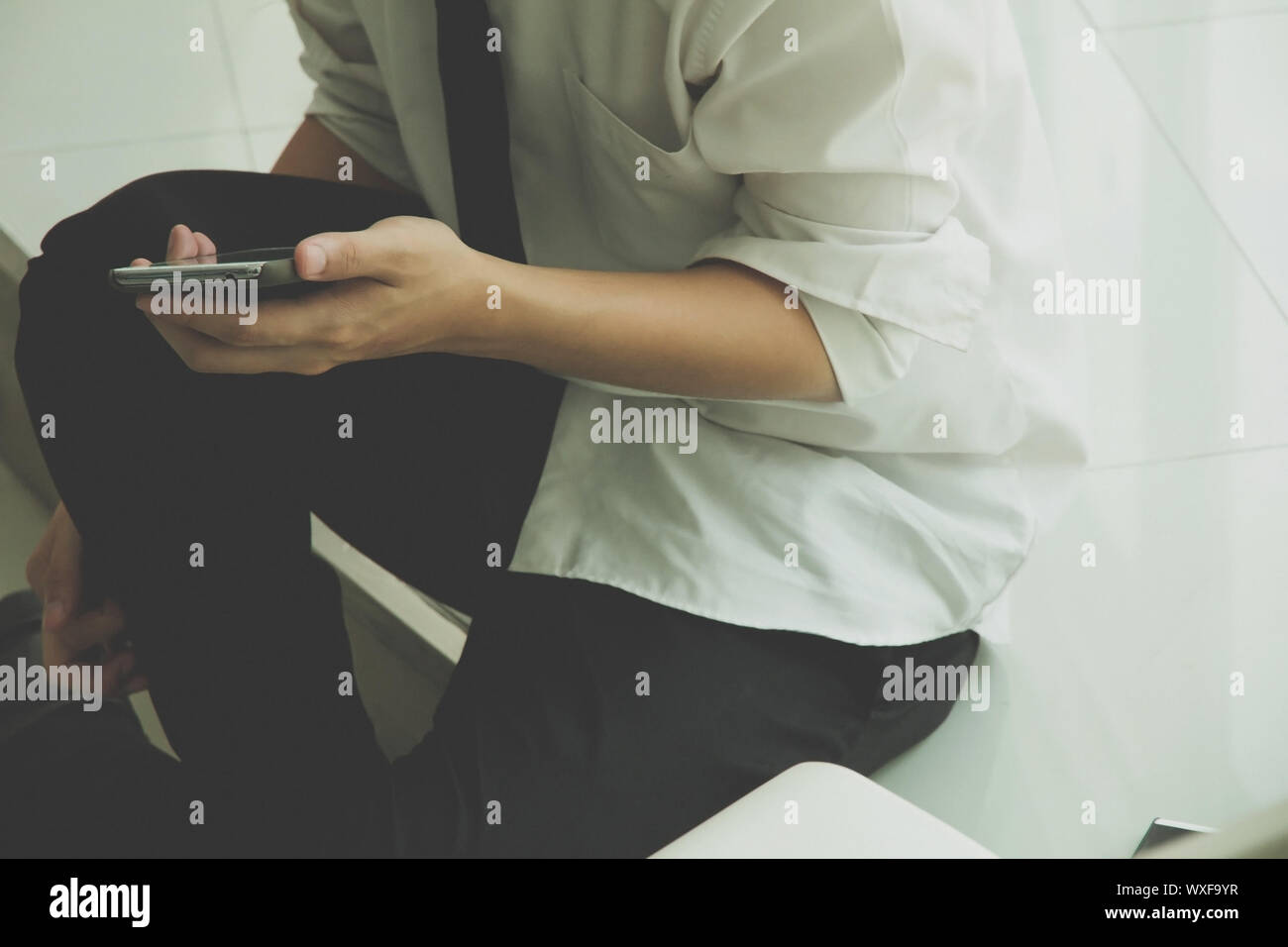 Professional young asian texting hi-res stock photography and images ...