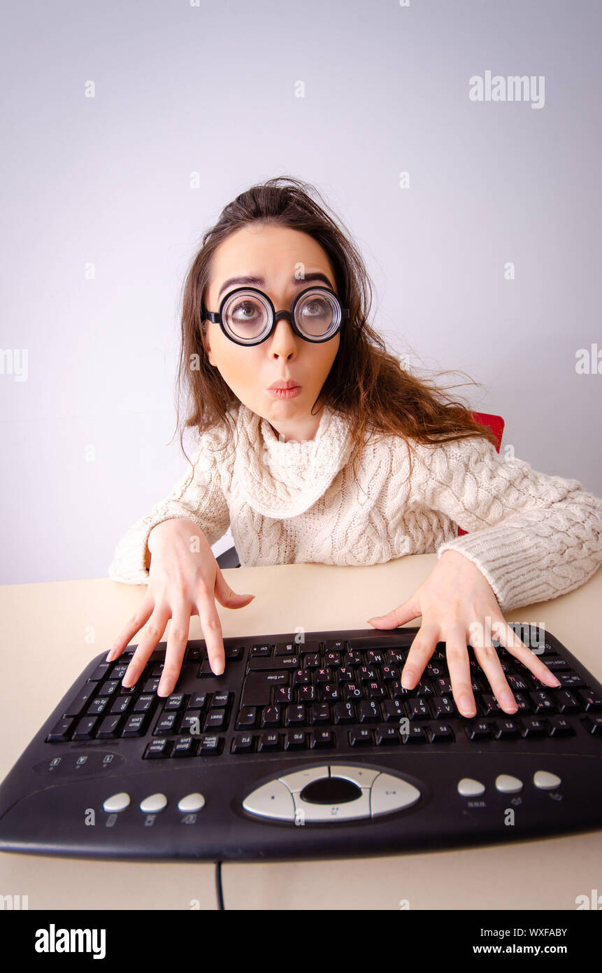 Funny nerd girl working on computer Stock Photo - Alamy