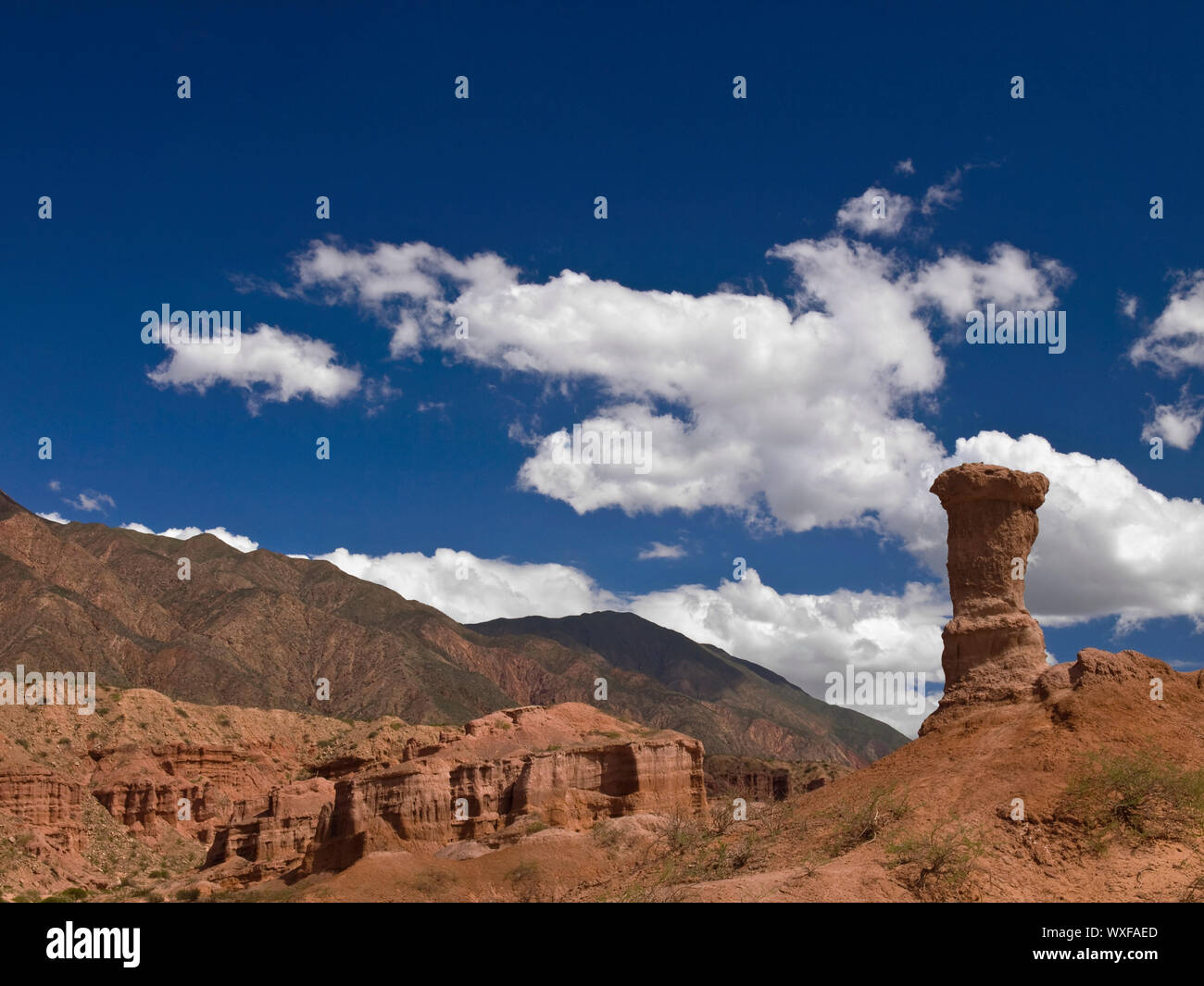 A remote desert landscape with a large sandstone structure formation ...