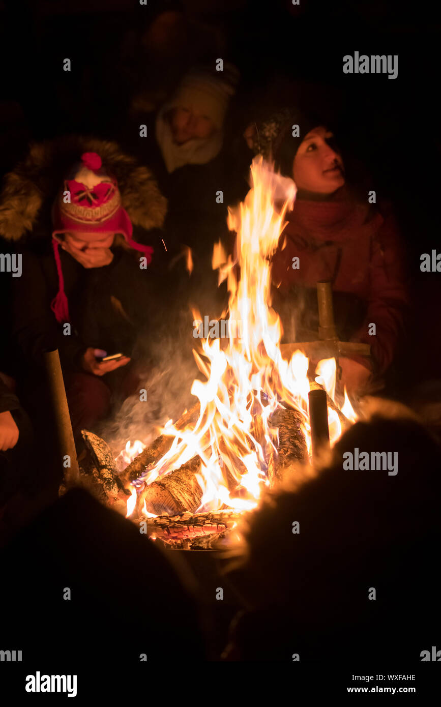 Tourist warming frozen hands fire hi-res stock photography and images ...