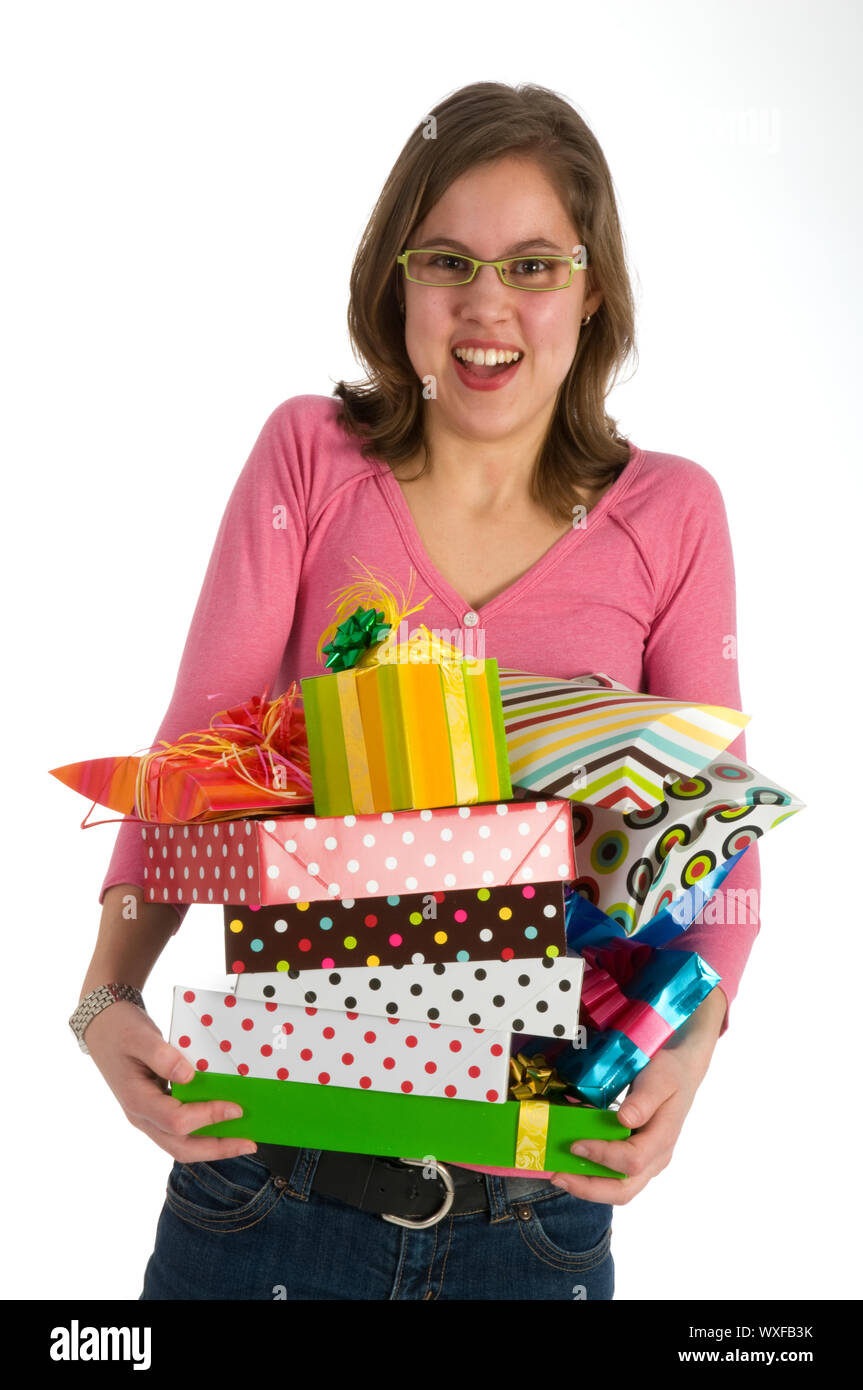 Surprised spoiled girl with many presents at her birthday Stock Photo ...