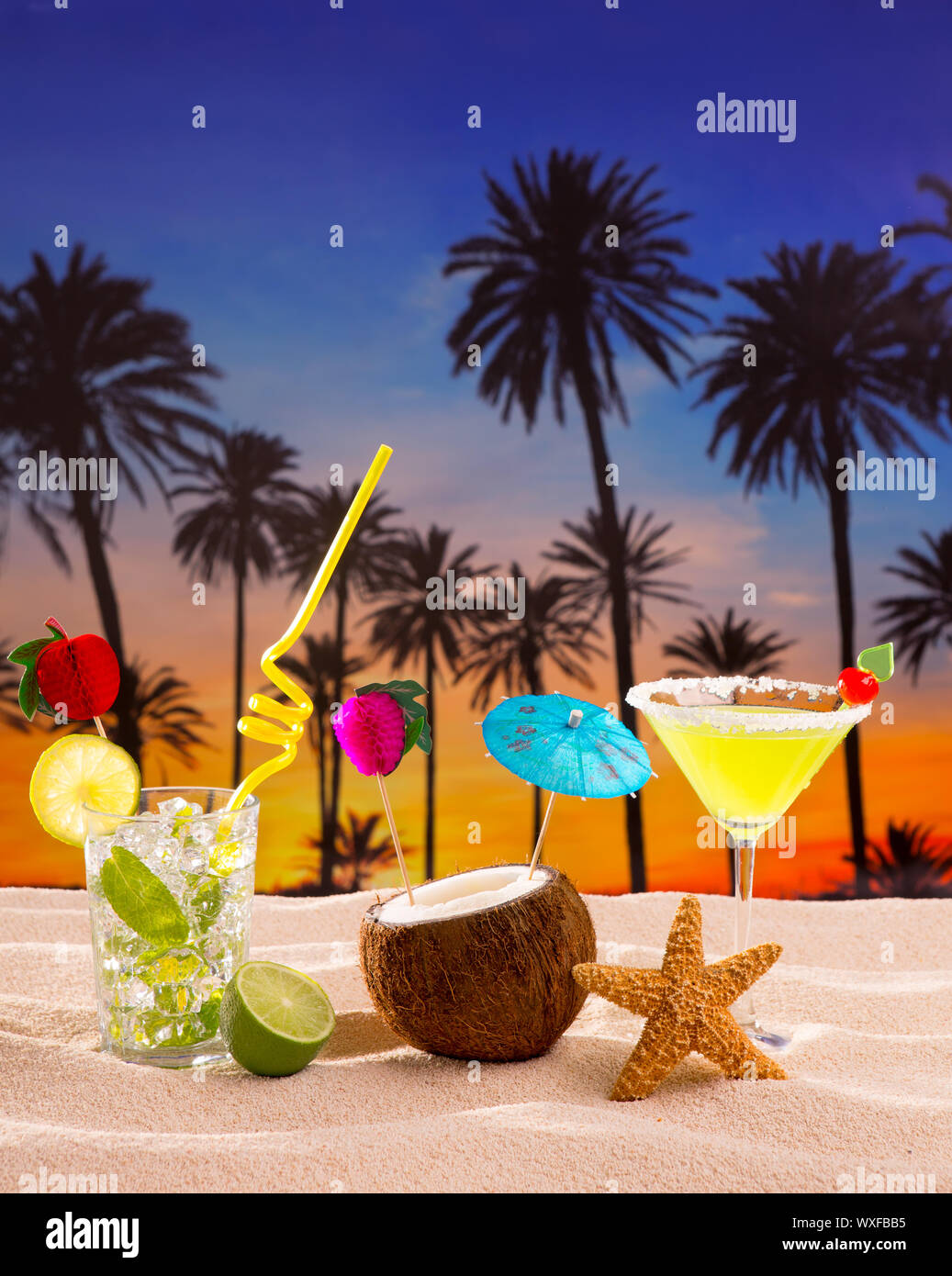 beach cocktail sunset on palm tree sand mojito margarita coconut Stock ...