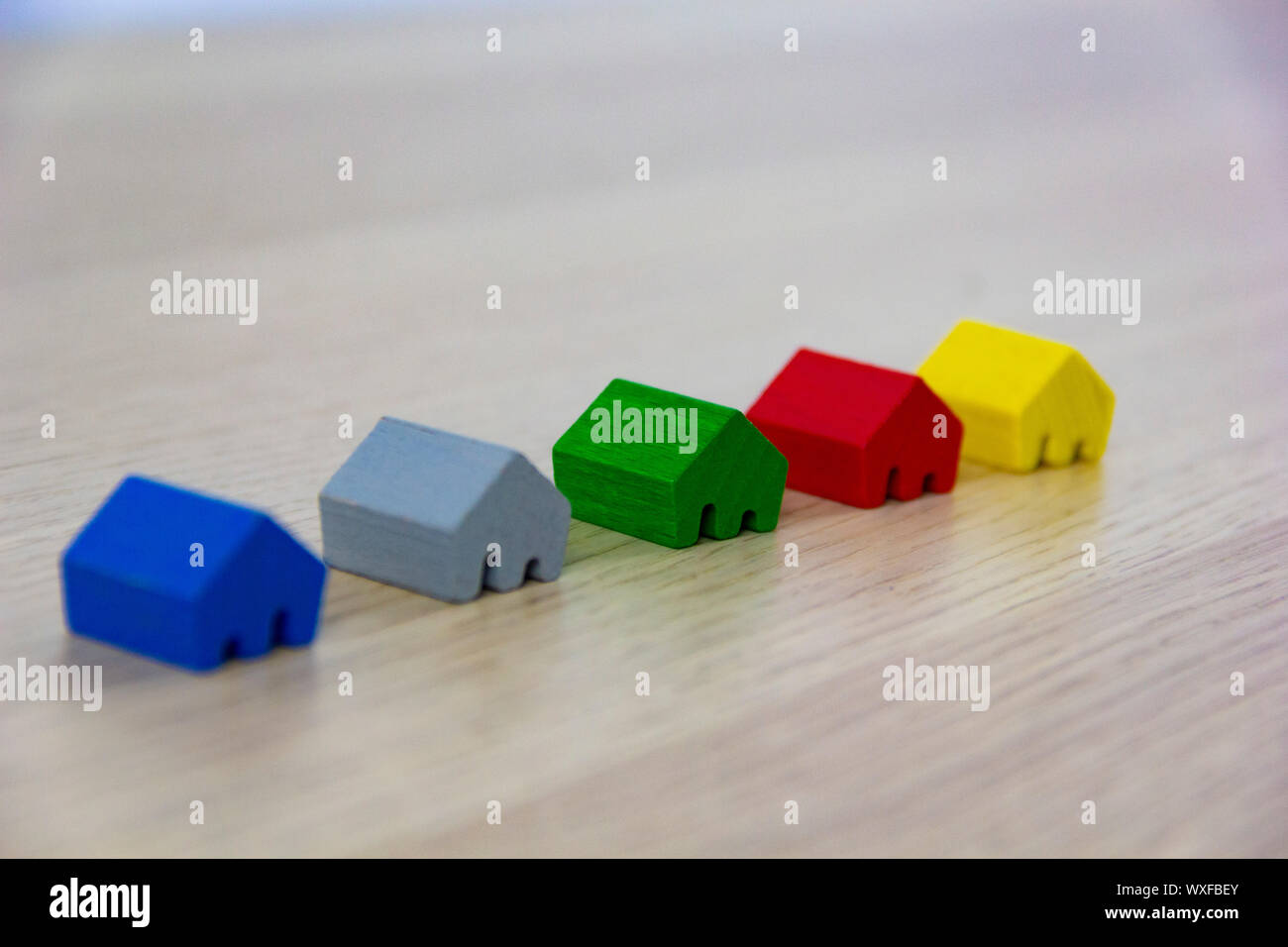 different colored game pieces representing different houses, concept of ...