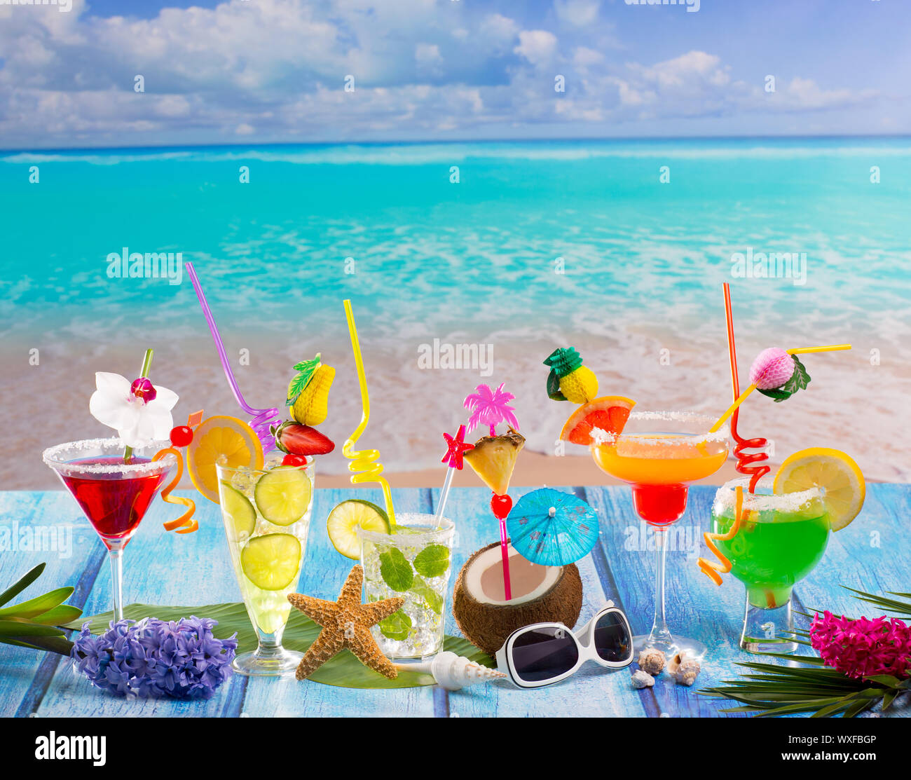 Colorful many tropical Cocktails in tropical blue wood at turquoise ...