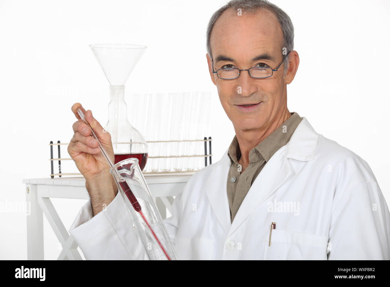 Scientist performing an experiment Stock Photo - Alamy