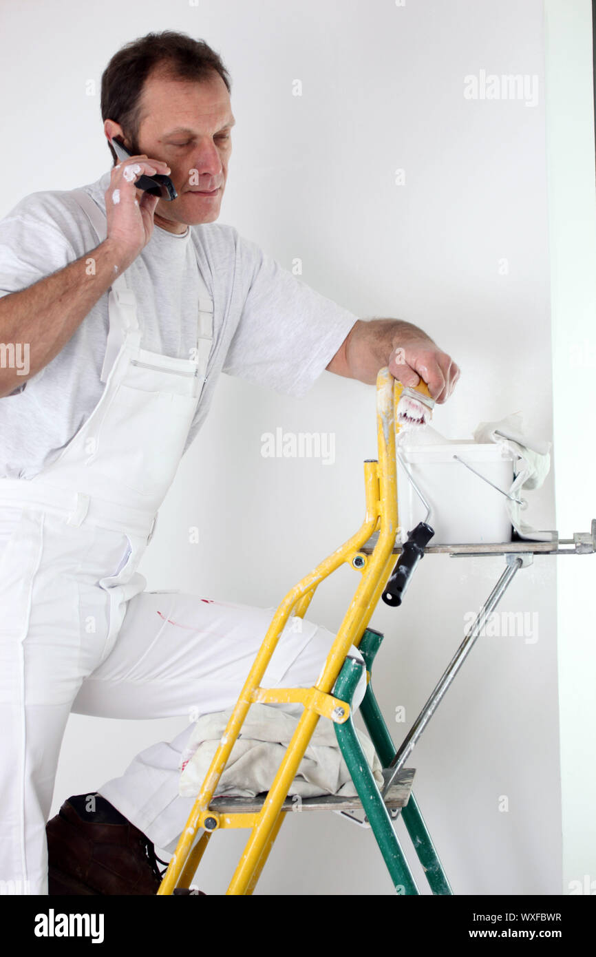 Painter making a phone call Stock Photo - Alamy