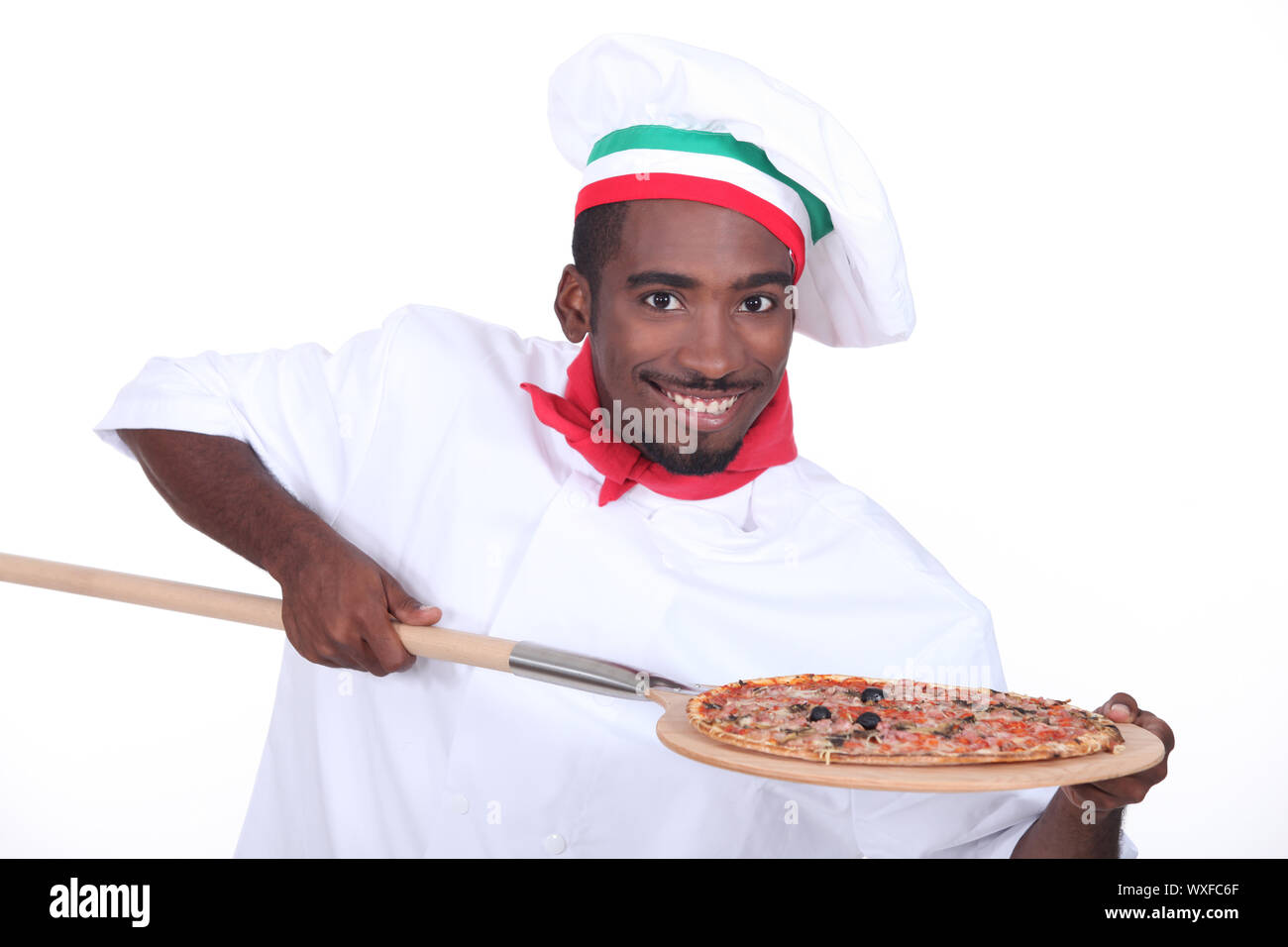 Italian chef with a pizza on a wooden peel Stock Photo - Alamy