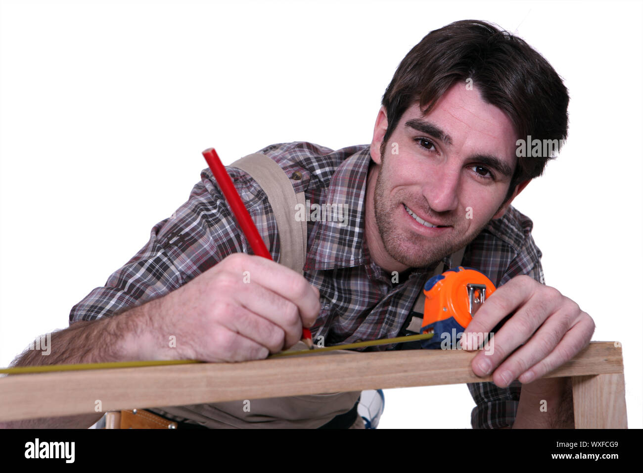 Man measuring furniture Stock Photo - Alamy