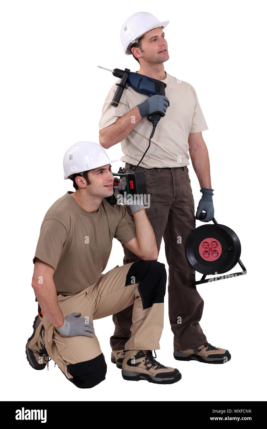 Tradesmen holding their tools Stock Photo - Alamy