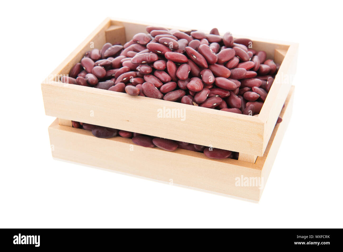 Wooden crate full with brown beans isolated over white background Stock ...