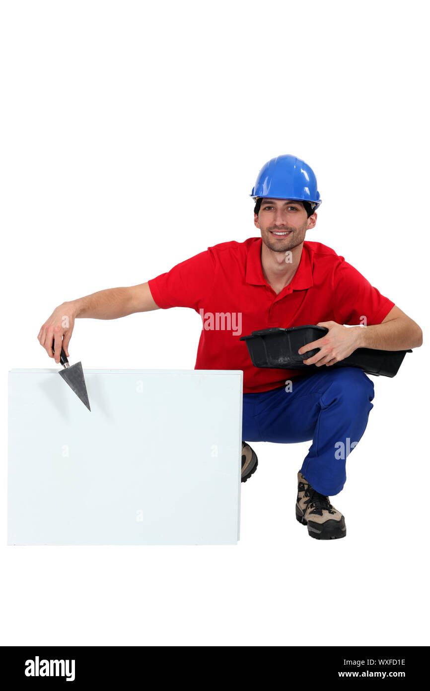 builder with trowel and cement Stock Photo - Alamy