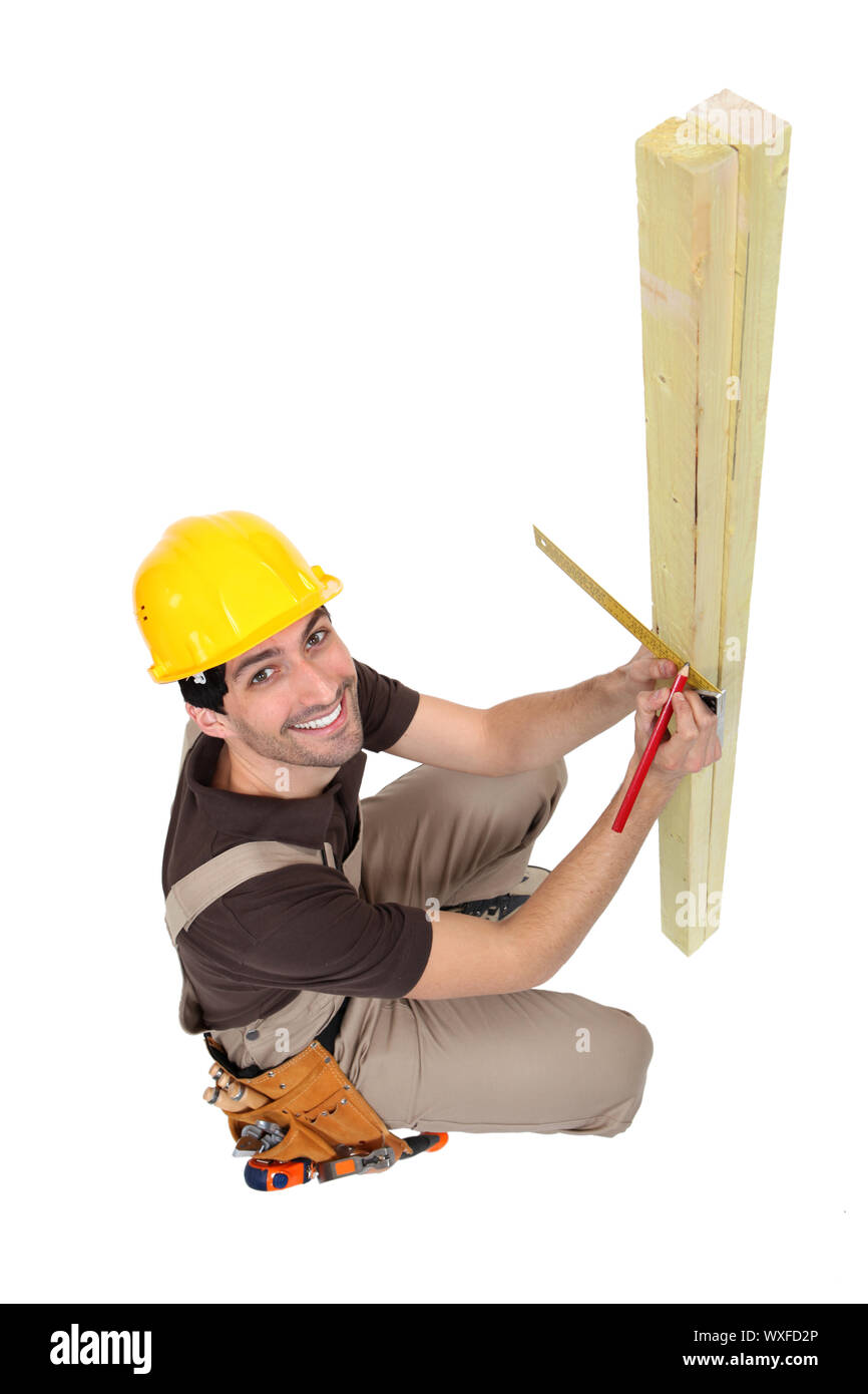 Man measuring wood Stock Photo - Alamy