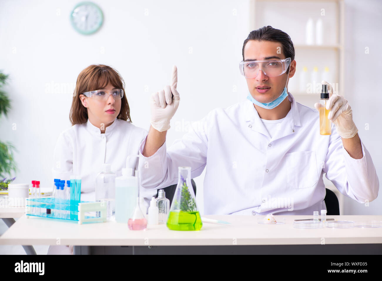 Two chemists working in the lab Stock Photo - Alamy