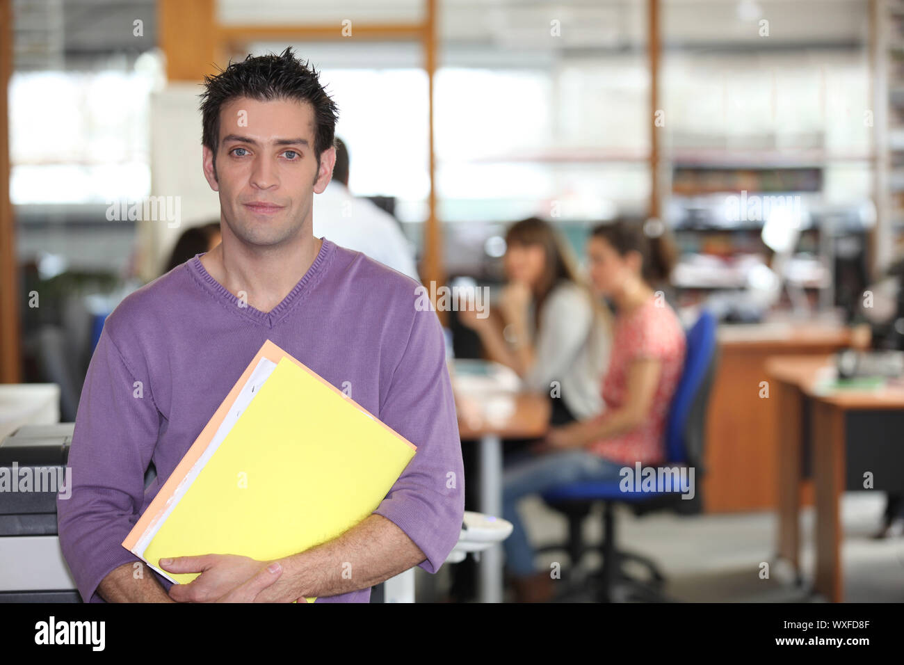 Carrying underarm hi-res stock photography and images - Alamy