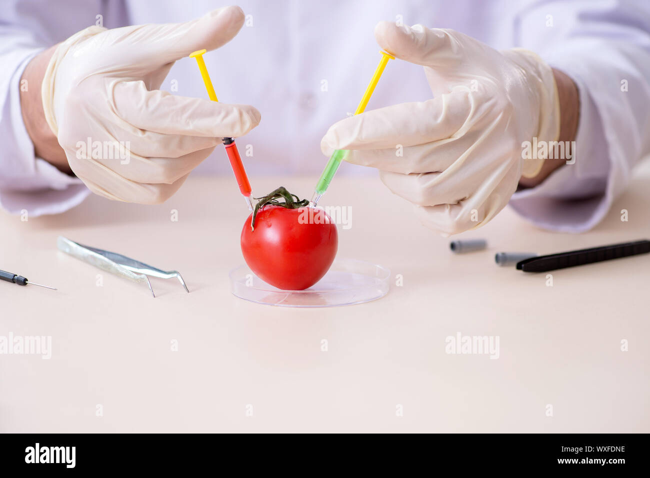 Male nutrition expert testing food products in lab Stock Photo - Alamy