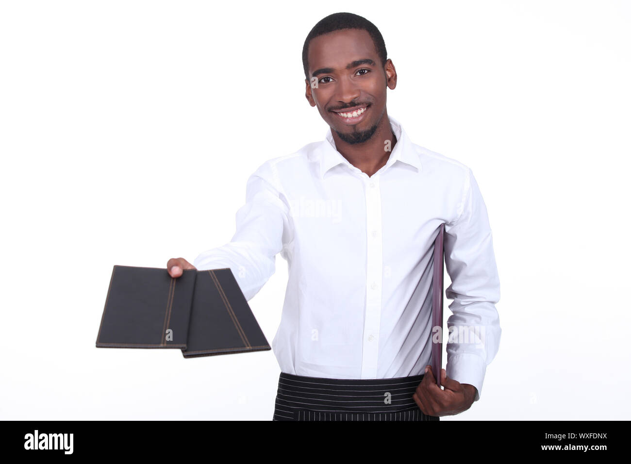 Waitor giving menus Stock Photo - Alamy