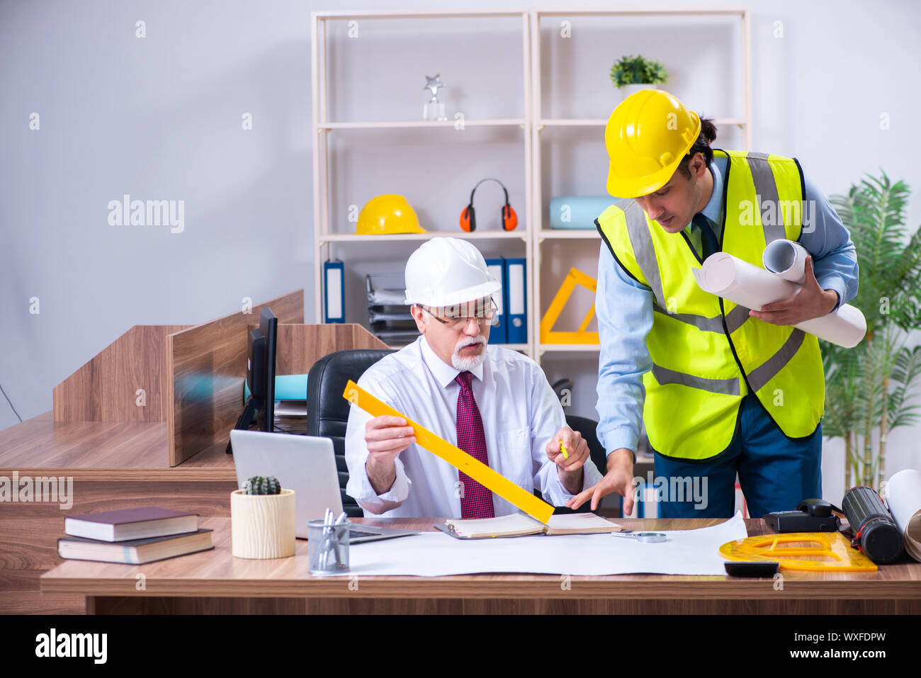 Two architects working on the project Stock Photo - Alamy