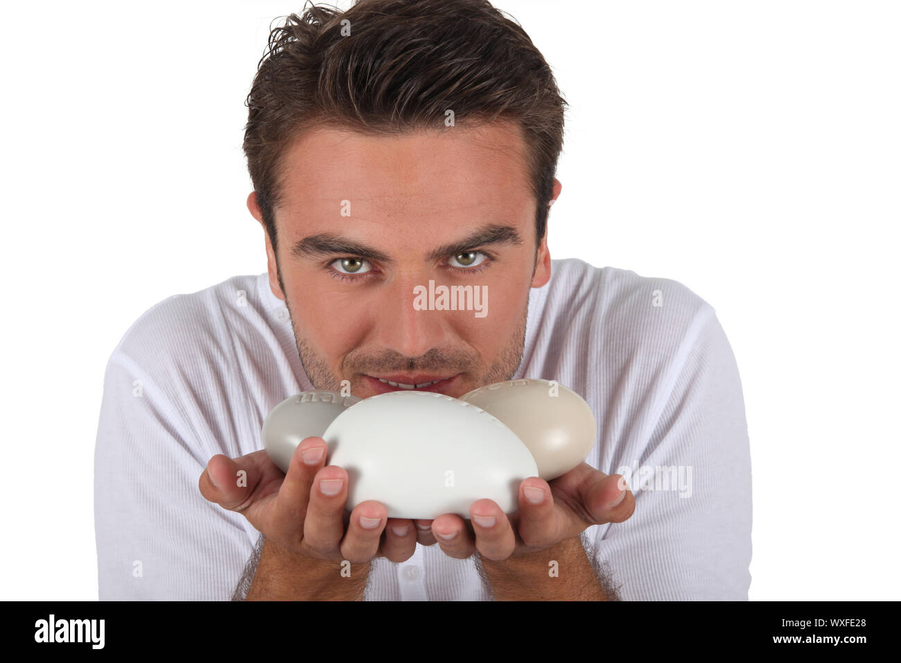 Man smelling bars of soap Stock Photo - Alamy