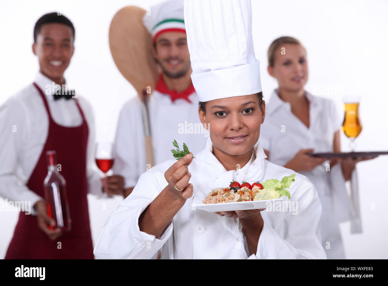 Female chef presenting plate hi-res stock photography and images - Alamy